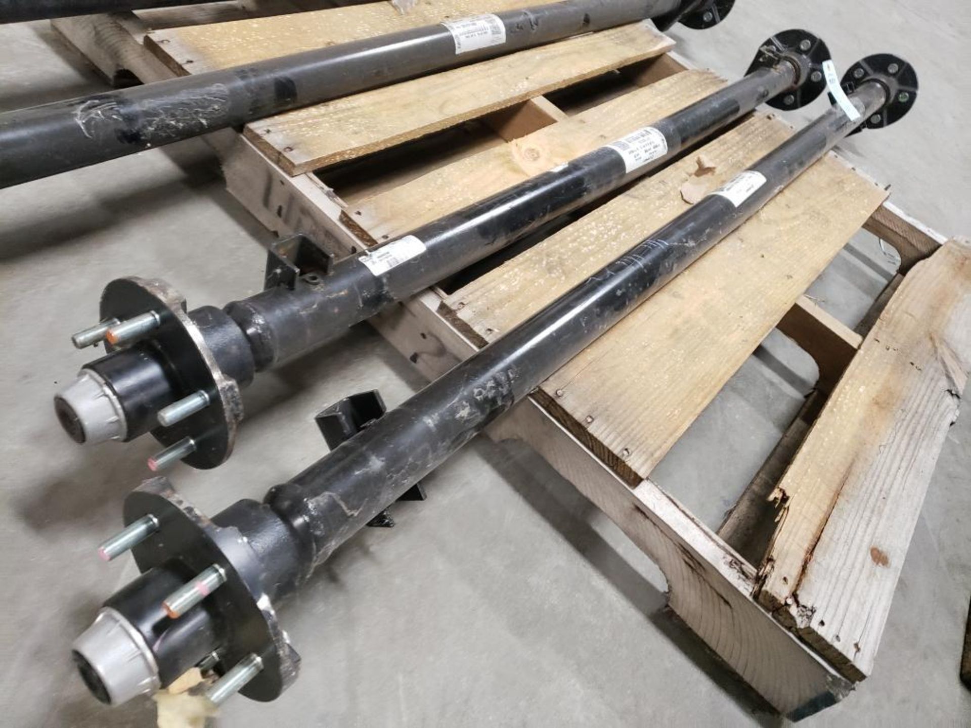 Qty 4 - Assorted axles. For a $60 fee this lot can be prepared for ...