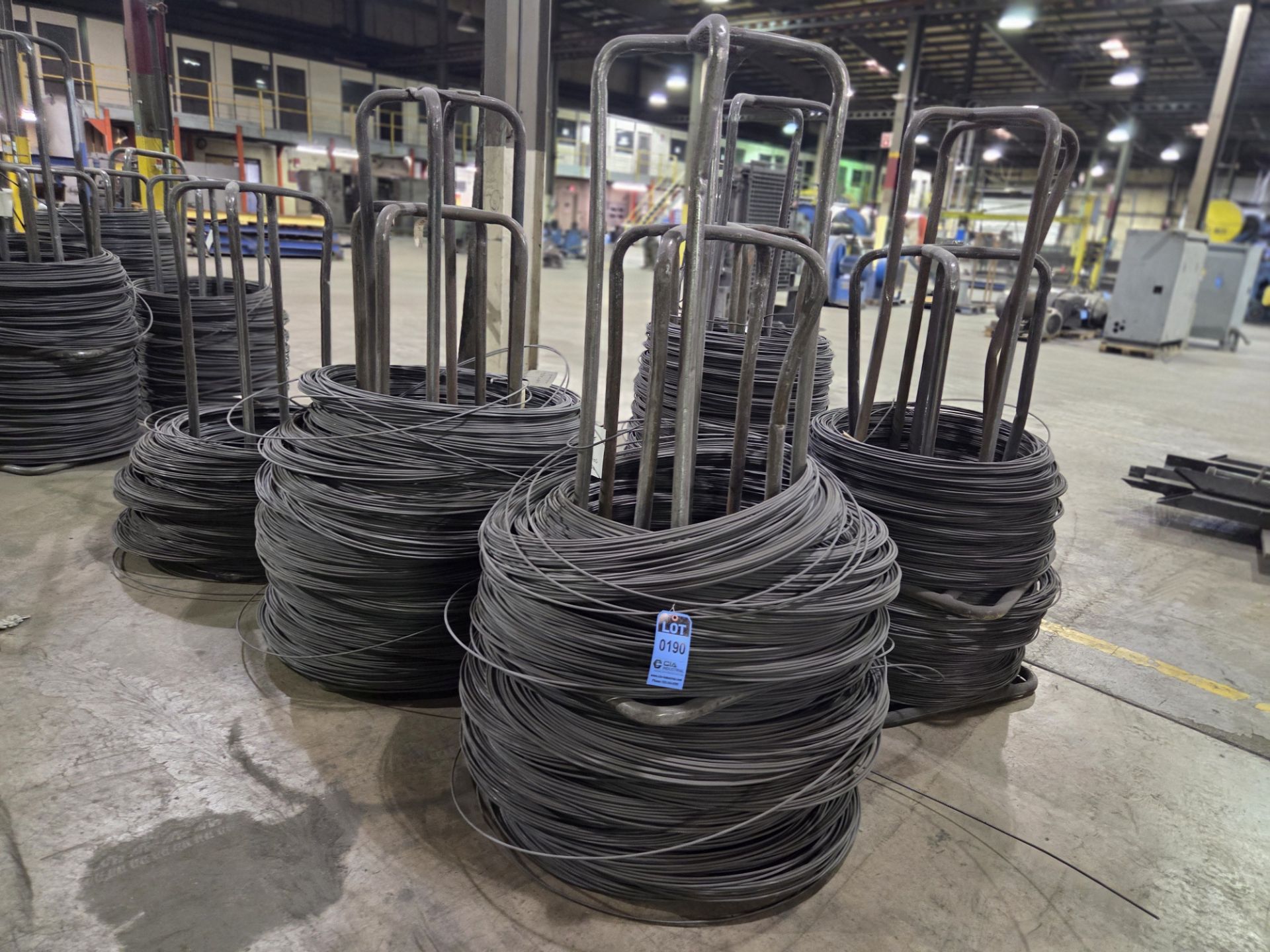 (13) STACKS STEEL REBAR COIL STOCK - (18) RACKS - For convenience, the ...