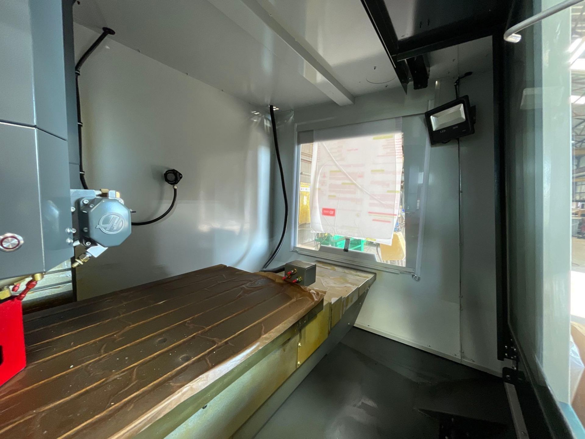 HAAS VF-5 / 40 XT VERTICAL MACHINING CENTER, 60 X 26 X 25" TRAVELS, CTS, WIPS, AUTO DOOR, PCOOL,