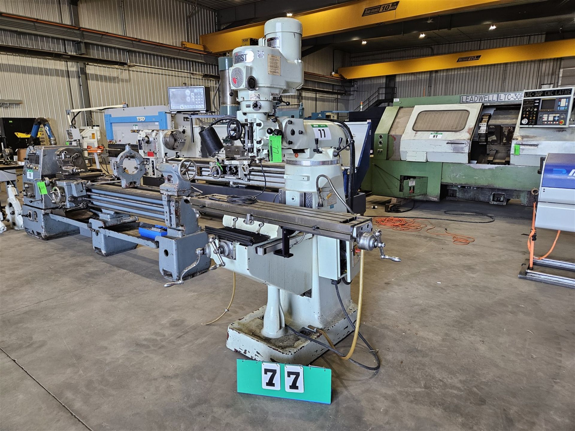 FIRST MILLING MACHINE, MODEL LC- 1 1/2 VS, 220V, 9 IN. X 50 IN. TABLE W ...