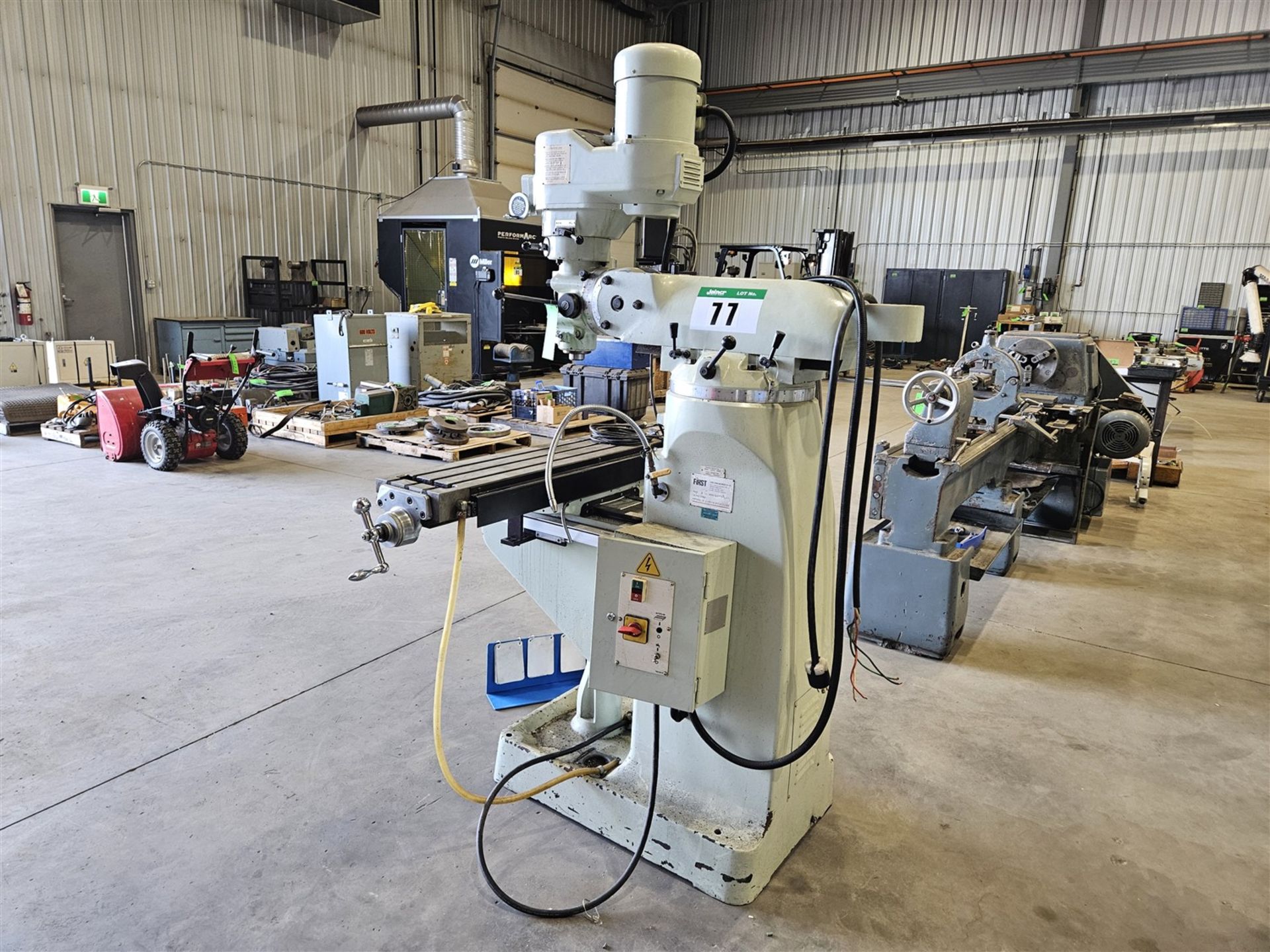 FIRST MILLING MACHINE, MODEL LC- 1 1/2 VS, 220V, 9 IN. X 50 IN. TABLE W ...
