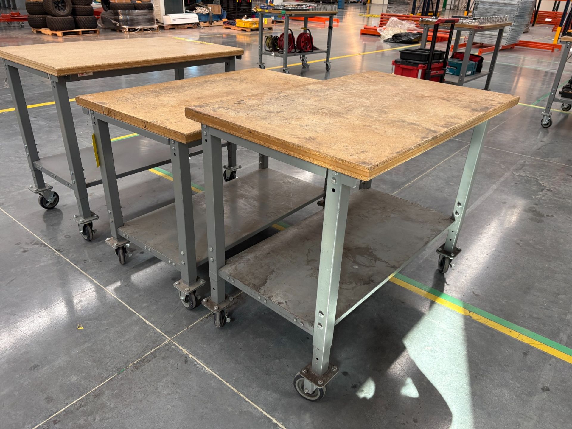 Lot of workbench , containing: 7 ULINE brand mobile work tables with 4 ...