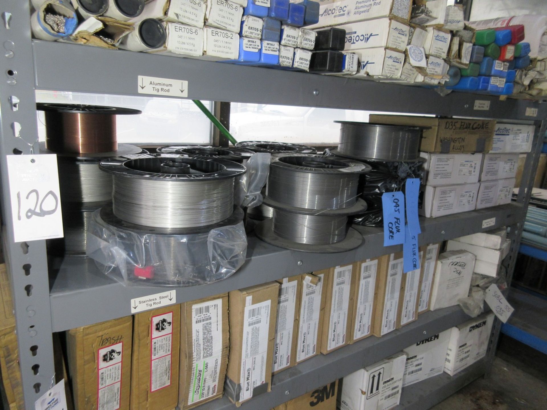 Assorted Spools of MIG Welding Wire on Shelf