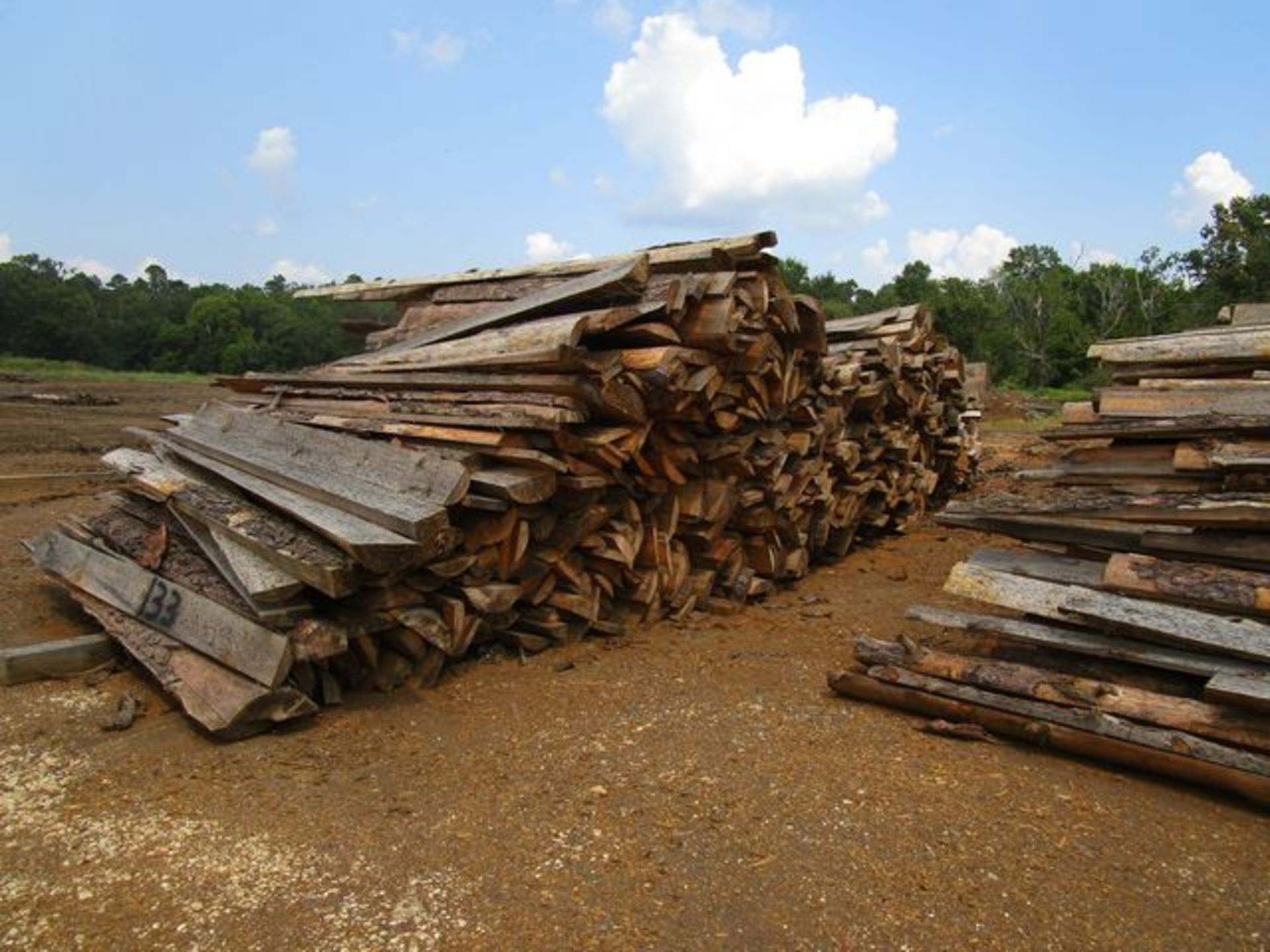LOT, APPROX. (45) TIMBERS AND LARGE LOT OF HALF LOGS IN BACK OF ...