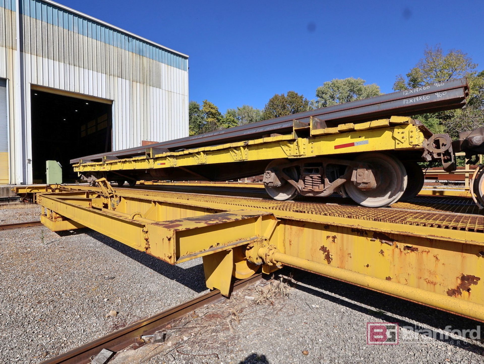 Approximately 55' Flatbed Wood Deck Railcar (no contents)