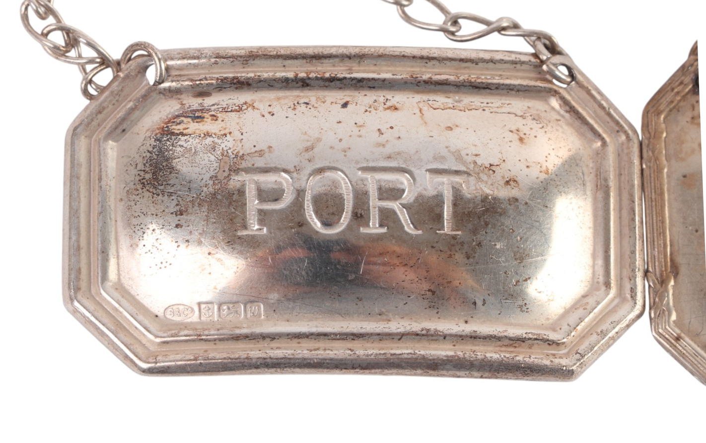 A set of three silver decanter labels, Sherry, Gin and Port; together ...