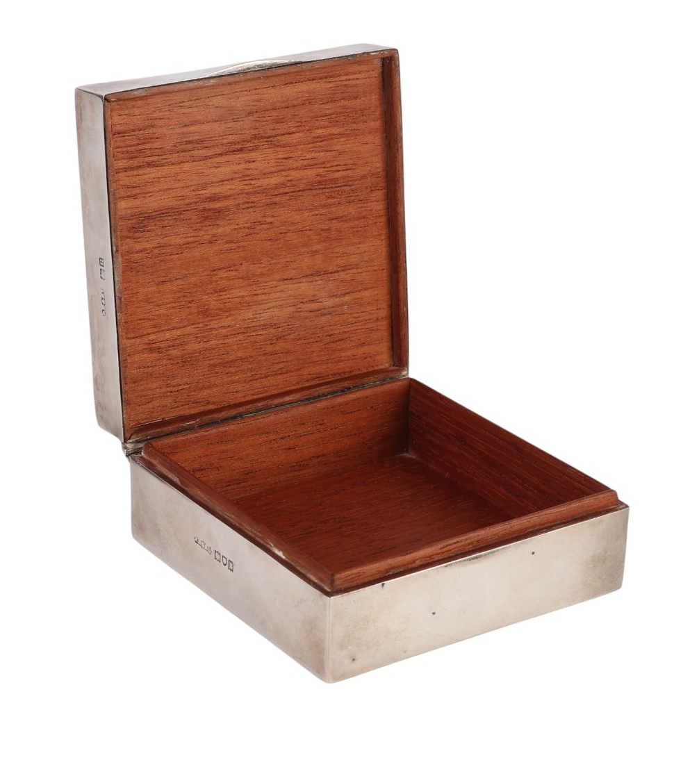 Taxidermy. A silver mounted tabletop cigarette box, the top mounted ...