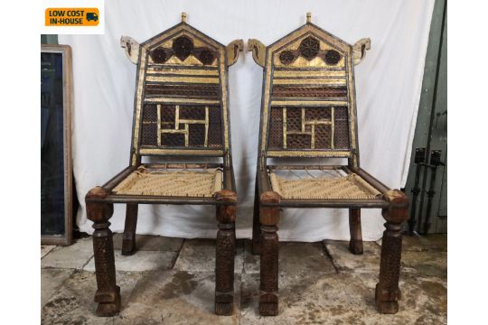 A pair of 19th century Indian hardwood Pida chairs each with a hammered ...