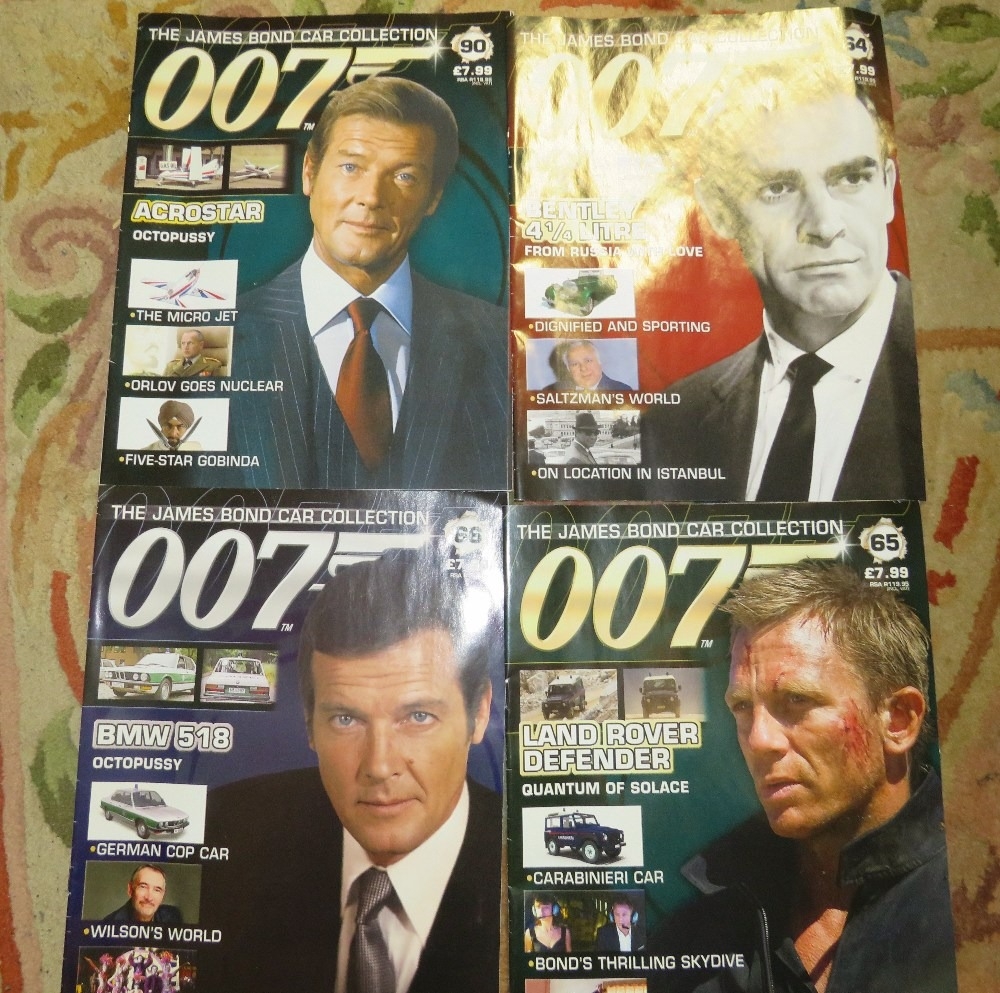 Two trays of approx 48 James Bond cars in Plastic cases some with magazines