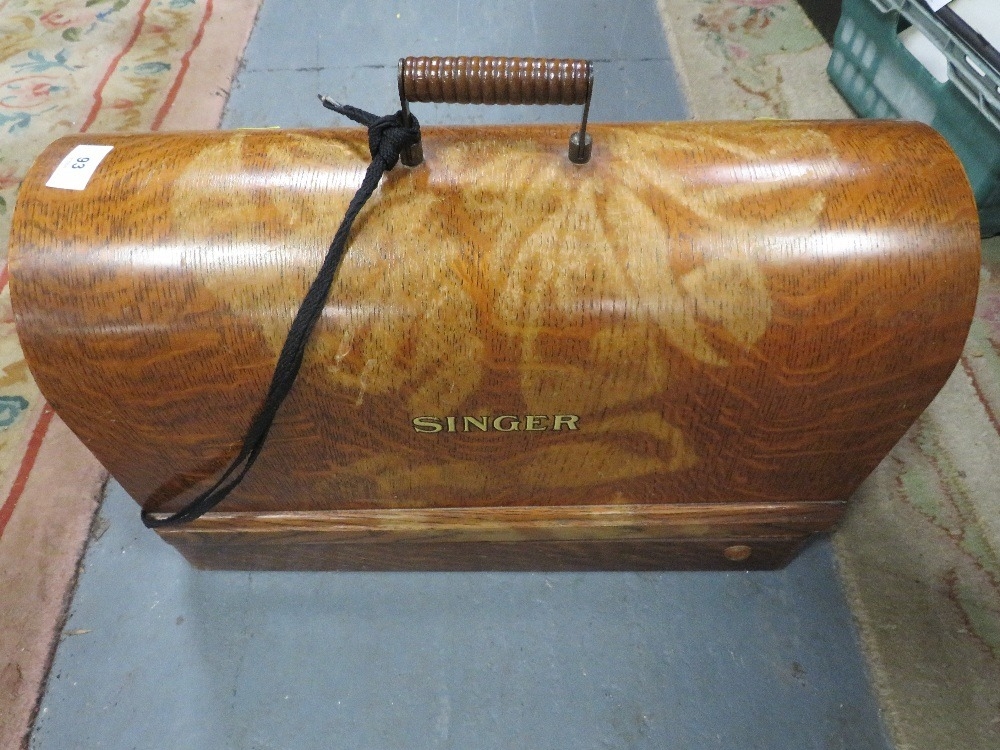 A vintage cased Singer sewing machine EDO38502