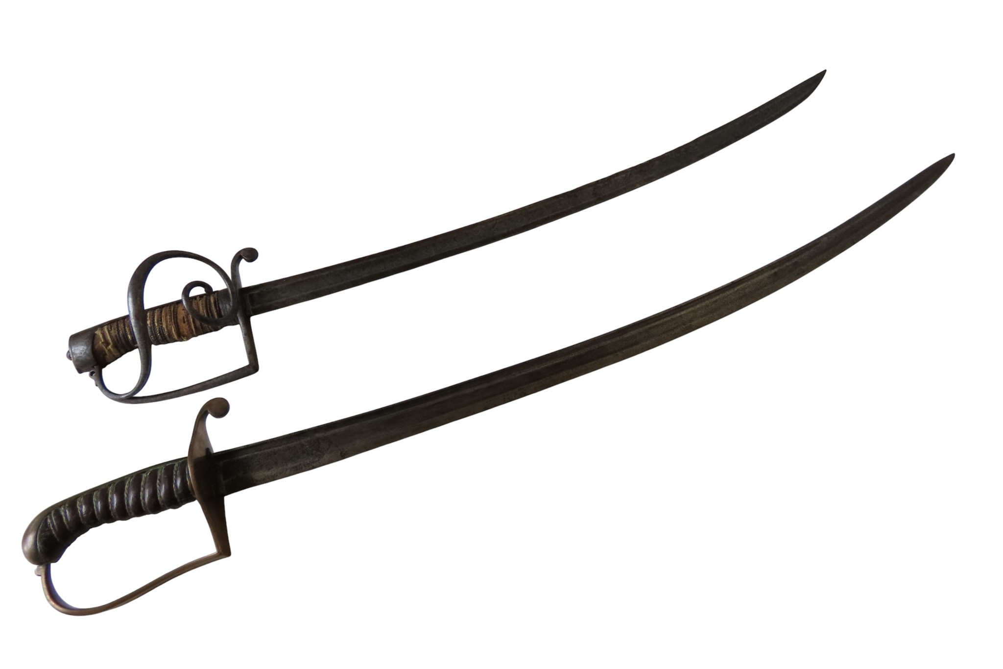 A GEORGIAN SWORD brass guard and leather grip, the plain curved blade ...