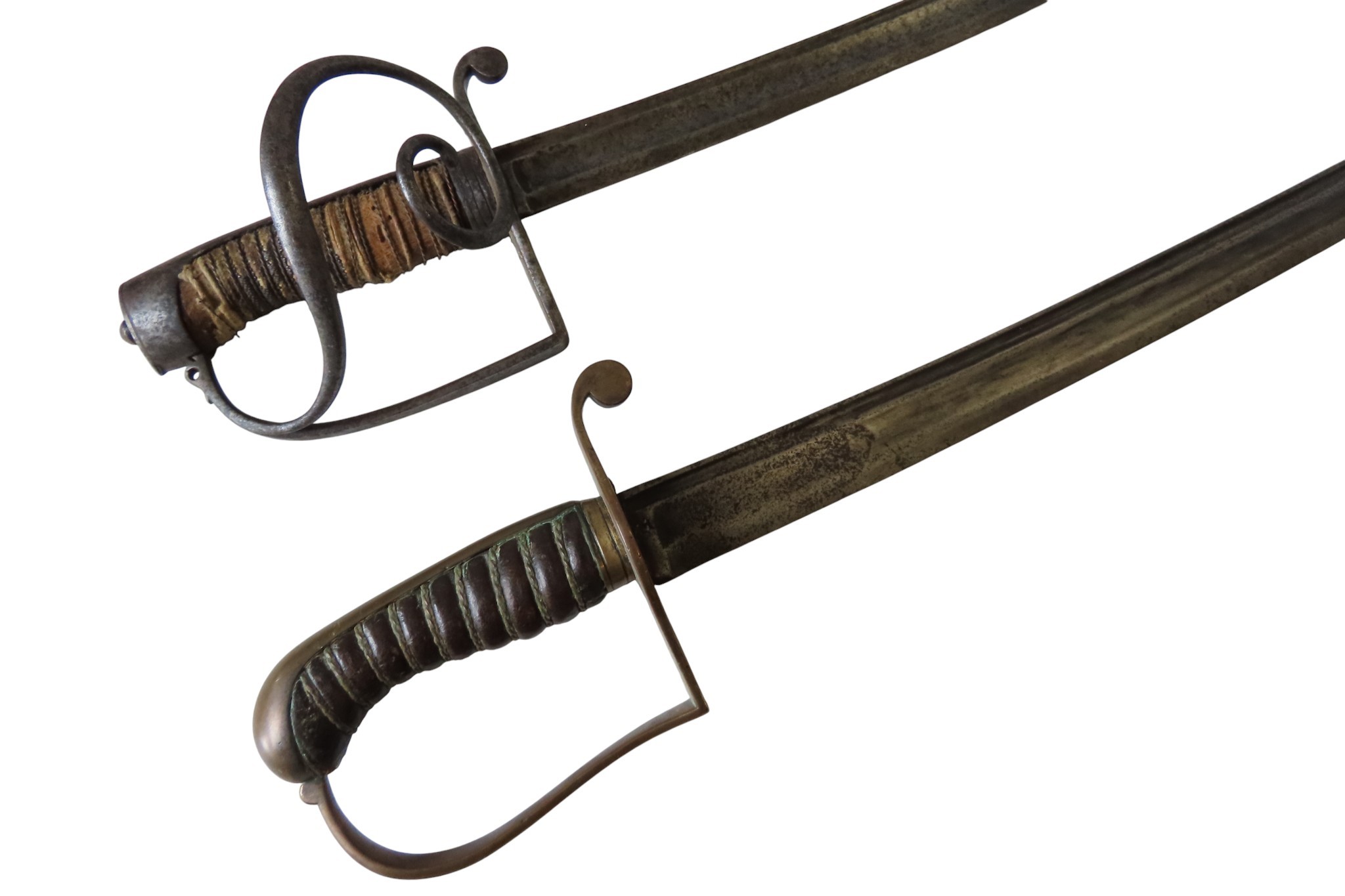 A GEORGIAN SWORD brass guard and leather grip, the plain curved blade ...