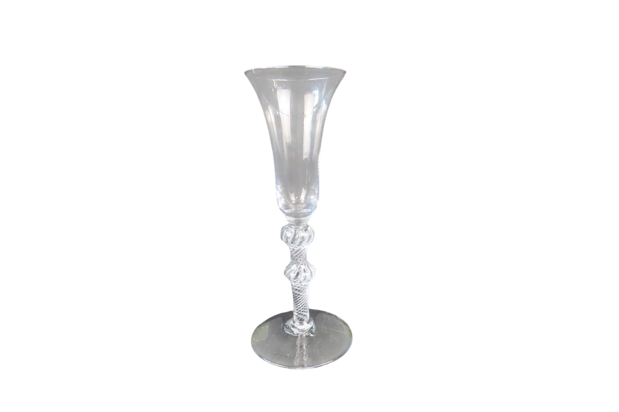 A FINE GEORGIAN AIR TWIST WINE GLASS circa 1750, the trumpet bowl over ...