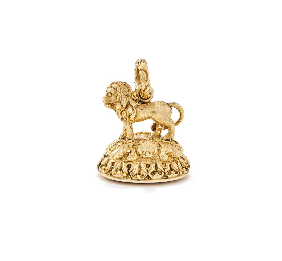 A 19TH CENTURY LION SHAPED FOB SEAL The statant lion above a floral ...