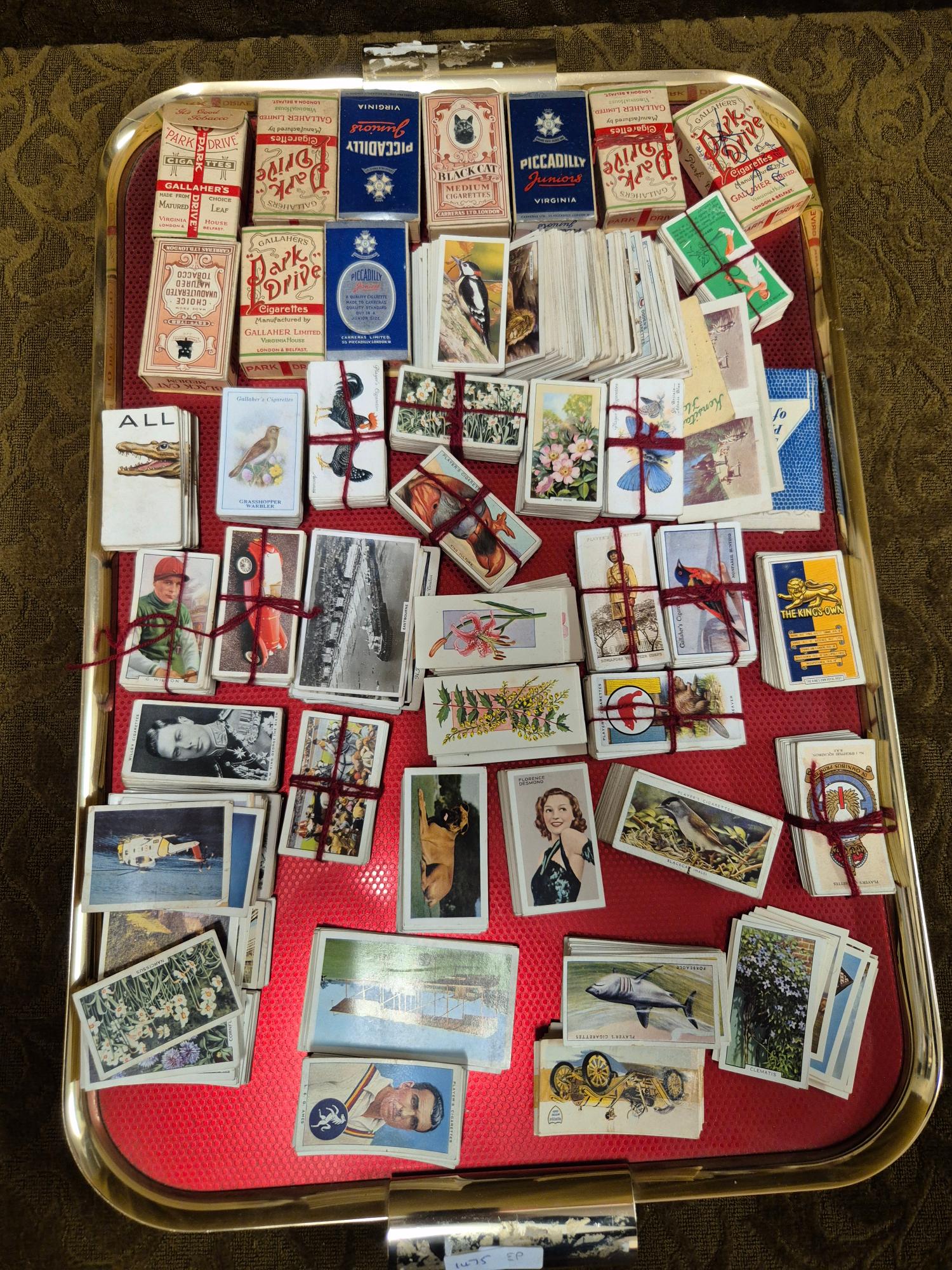 Collection of vintage cigarette cards.