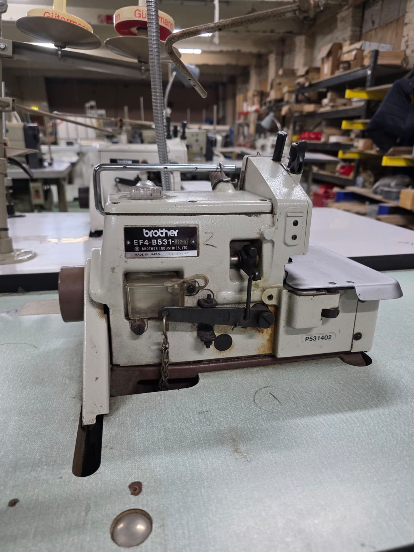 A Brother EF4--B531 -022-5 Overlocker Bench Mounted Sewing Machine.