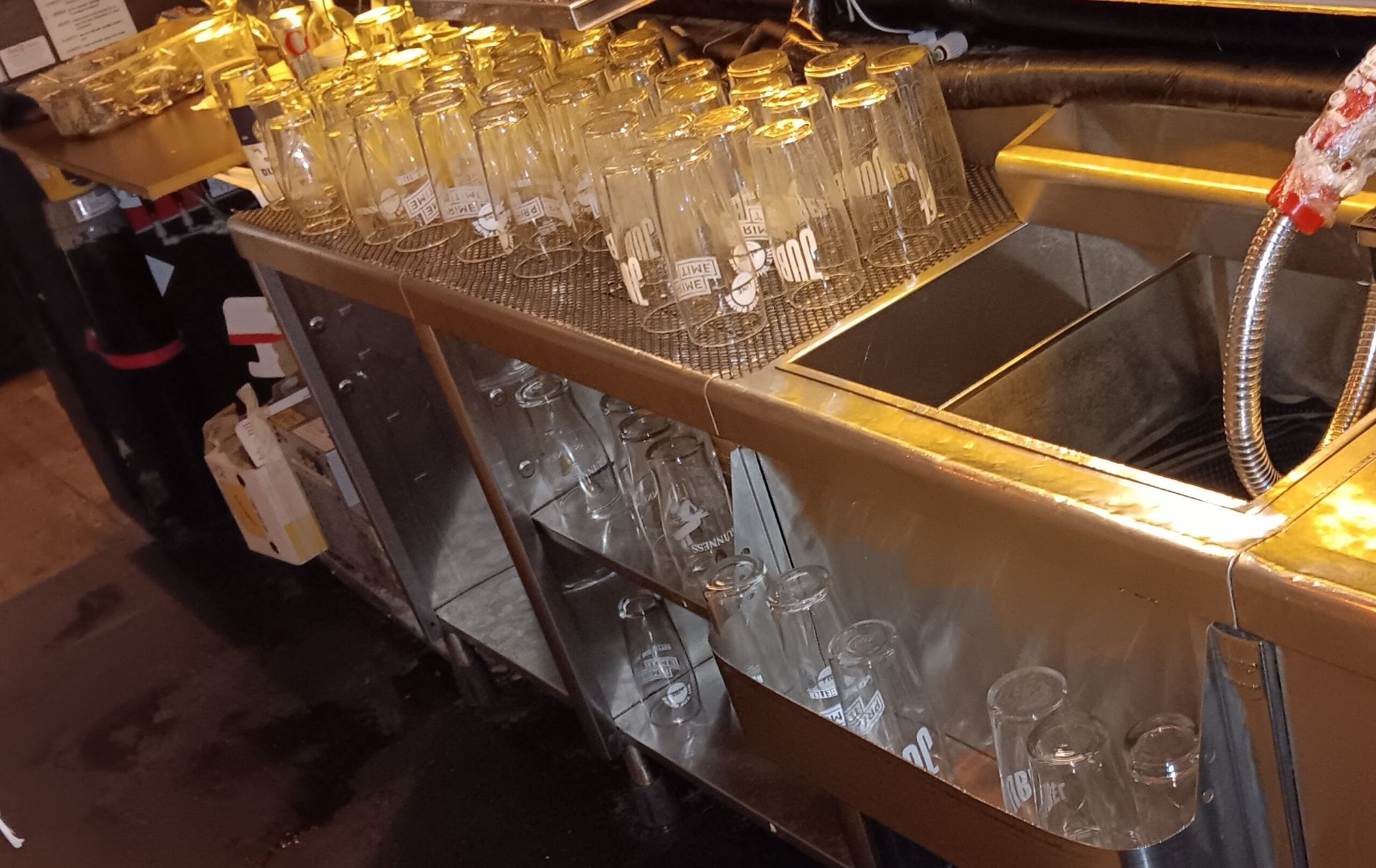 Quantity of assorted glassware to bar area, branded and unbranded ...
