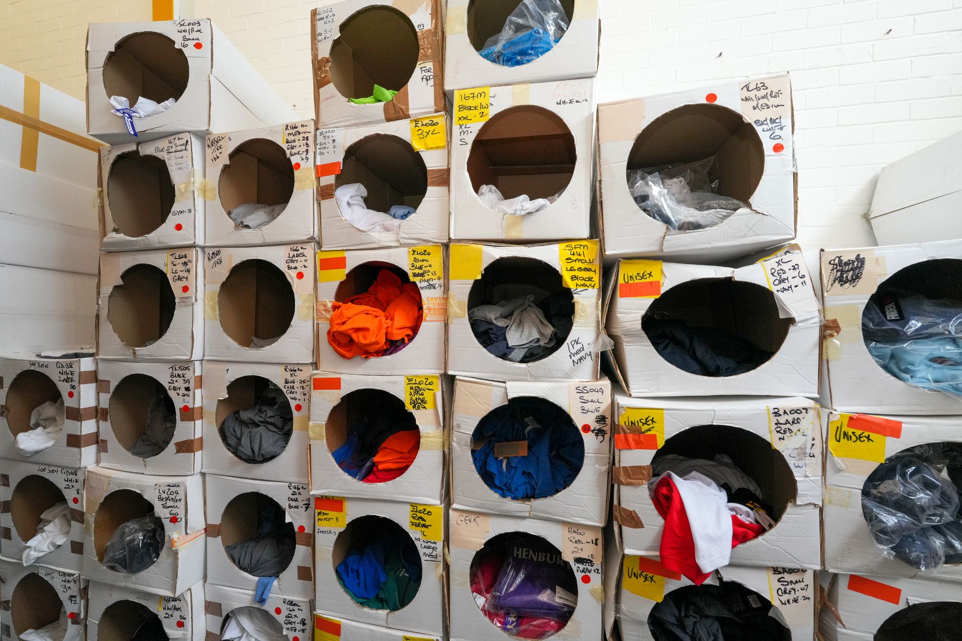 Very large quantity of assorted clothing to aisle 1