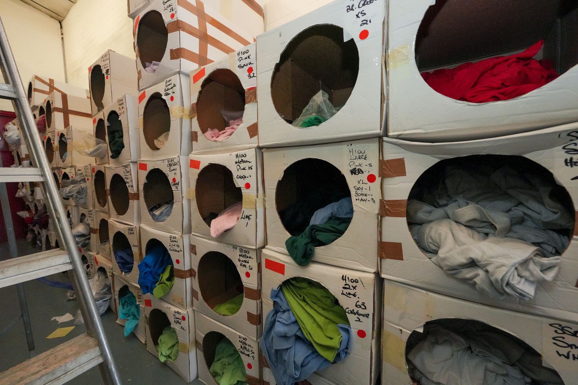 Very large quantity of assorted clothing to aisle 1