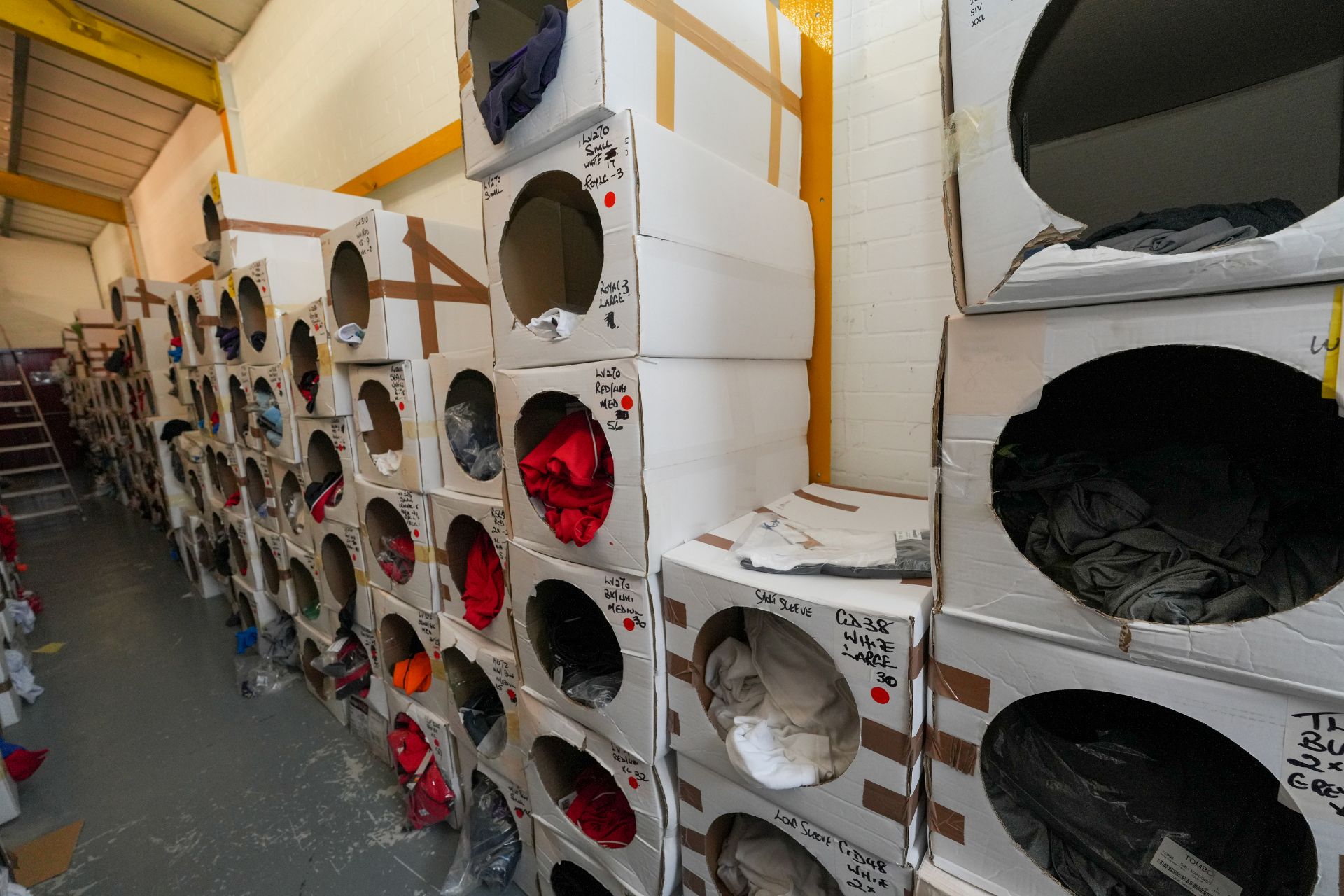 Very large quantity of assorted clothing to aisle 1