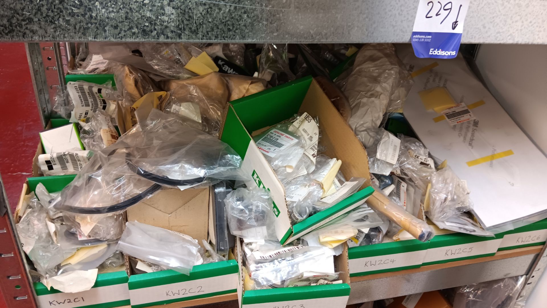 Assortment of Kawasaki parts/accessories to shelving bay (Viewing ...