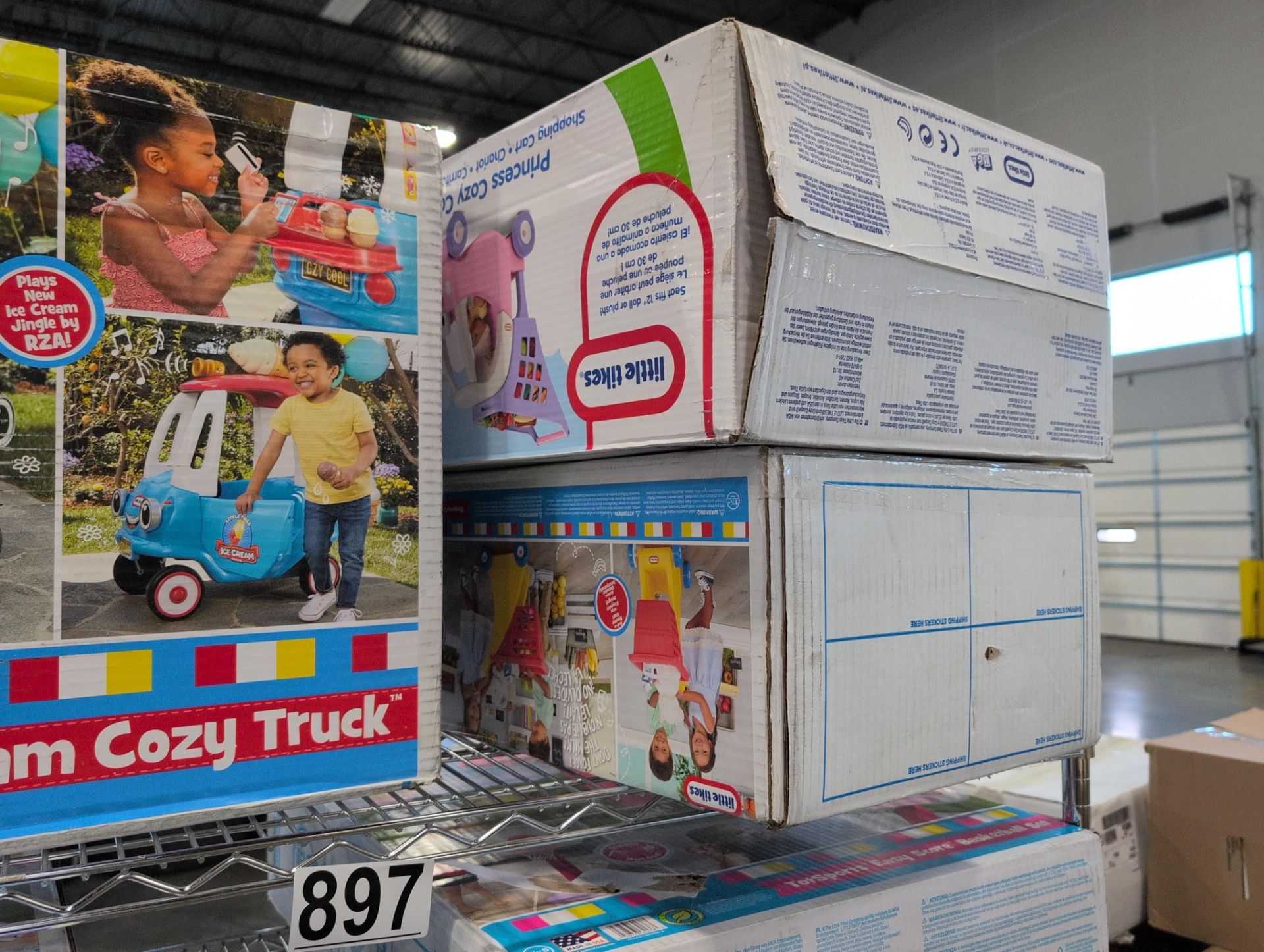 rolling rack of little tikes, ice cream sweet treat, shopping carts ...