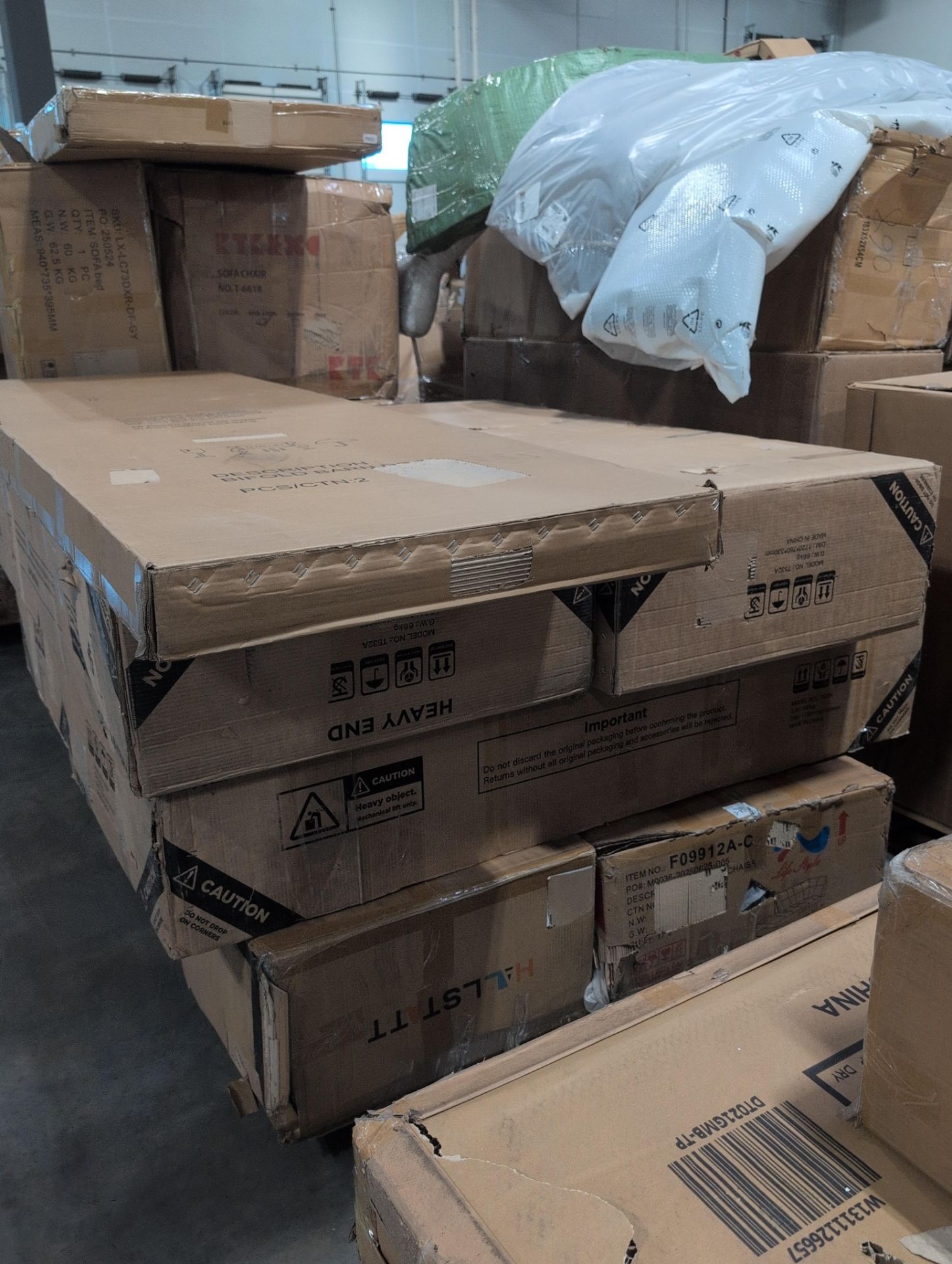 pallet of treadmills and furniture
