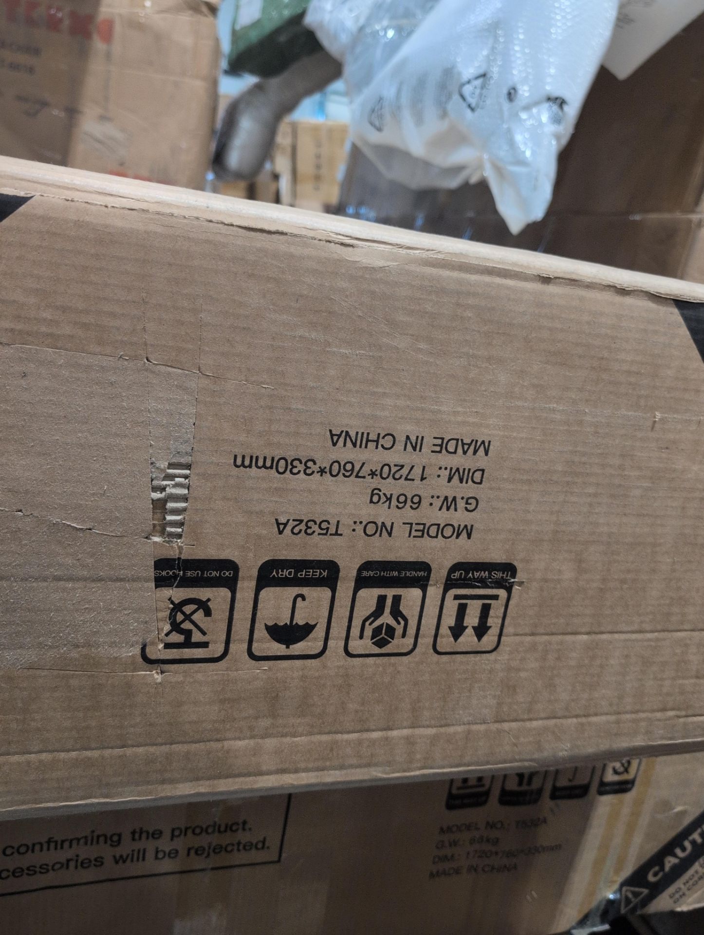 pallet of treadmills and furniture