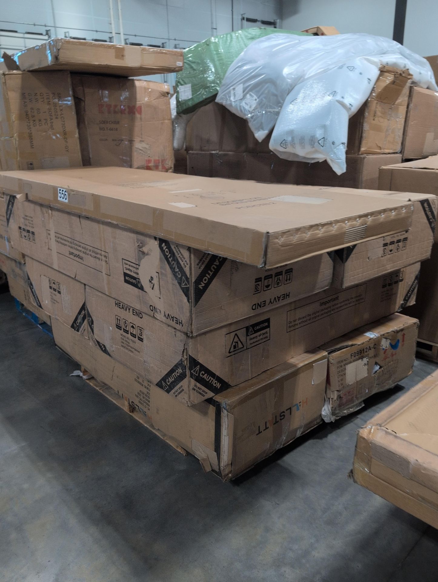 pallet of treadmills and furniture