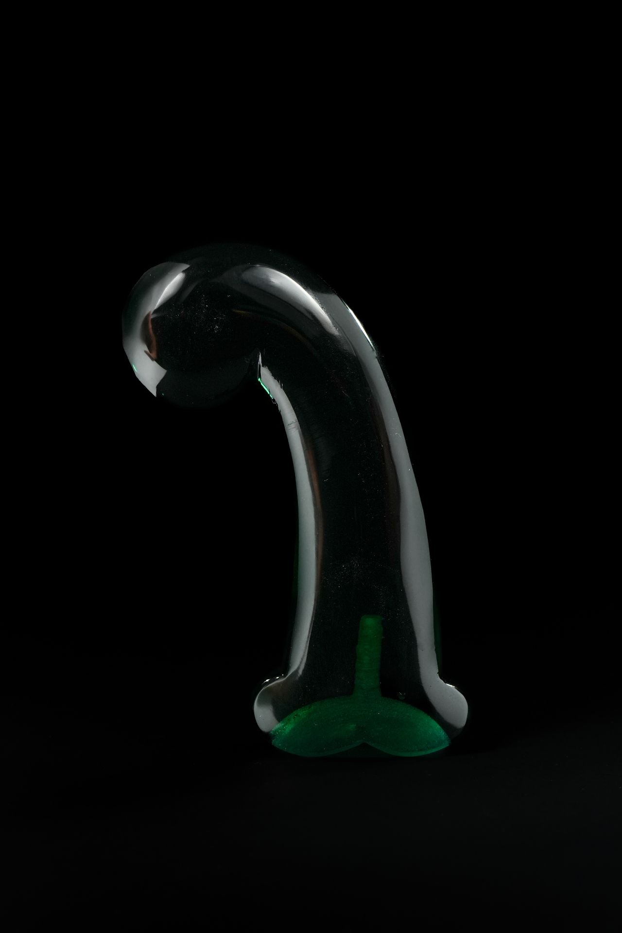 A Mughal Dark Green Glass Dagger Handle. A curved Mughal dagger handle ...