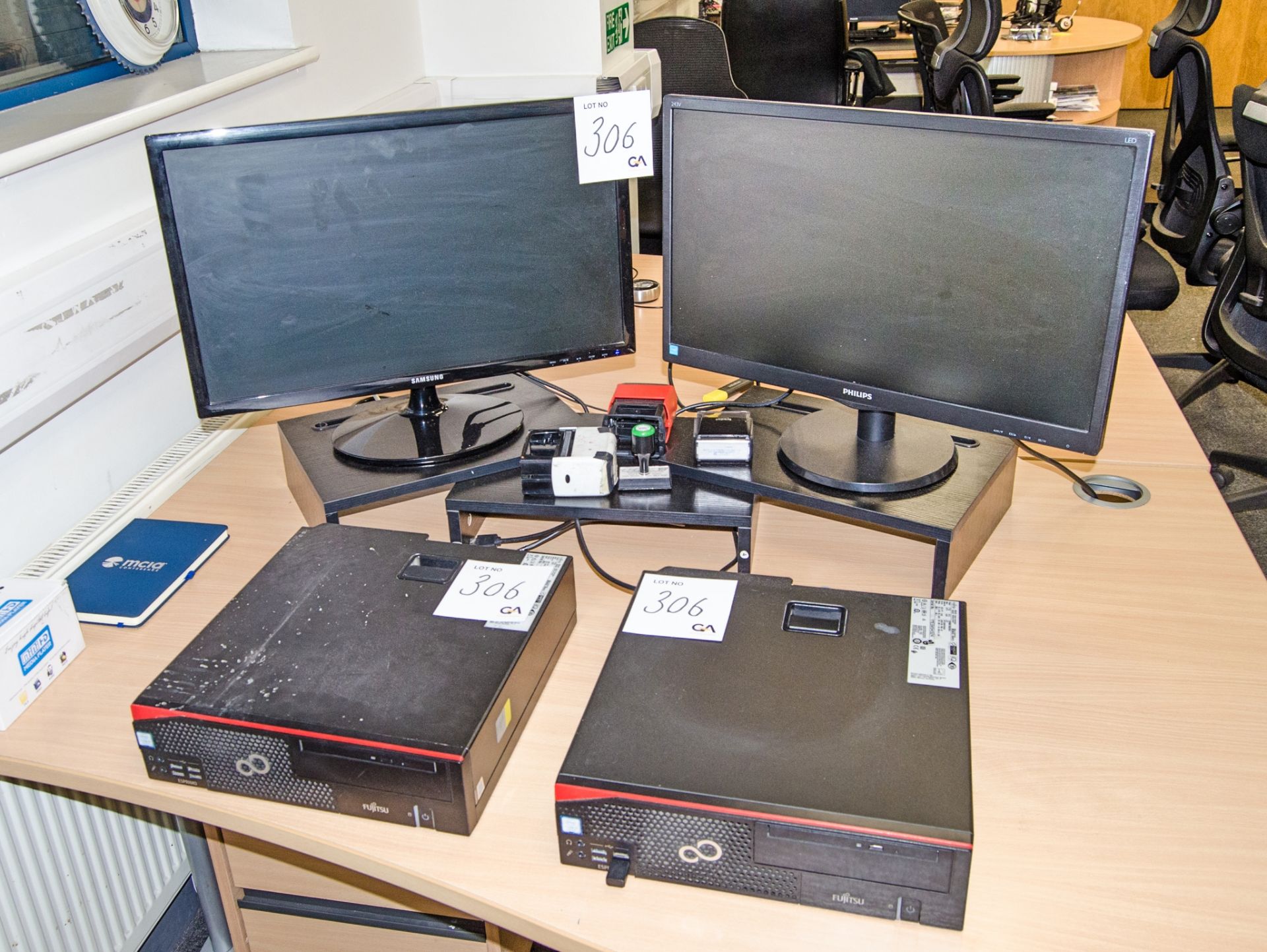 2 - Fujitsu desktop CPUs and 2 - monitors ** Lot located at CCM ...