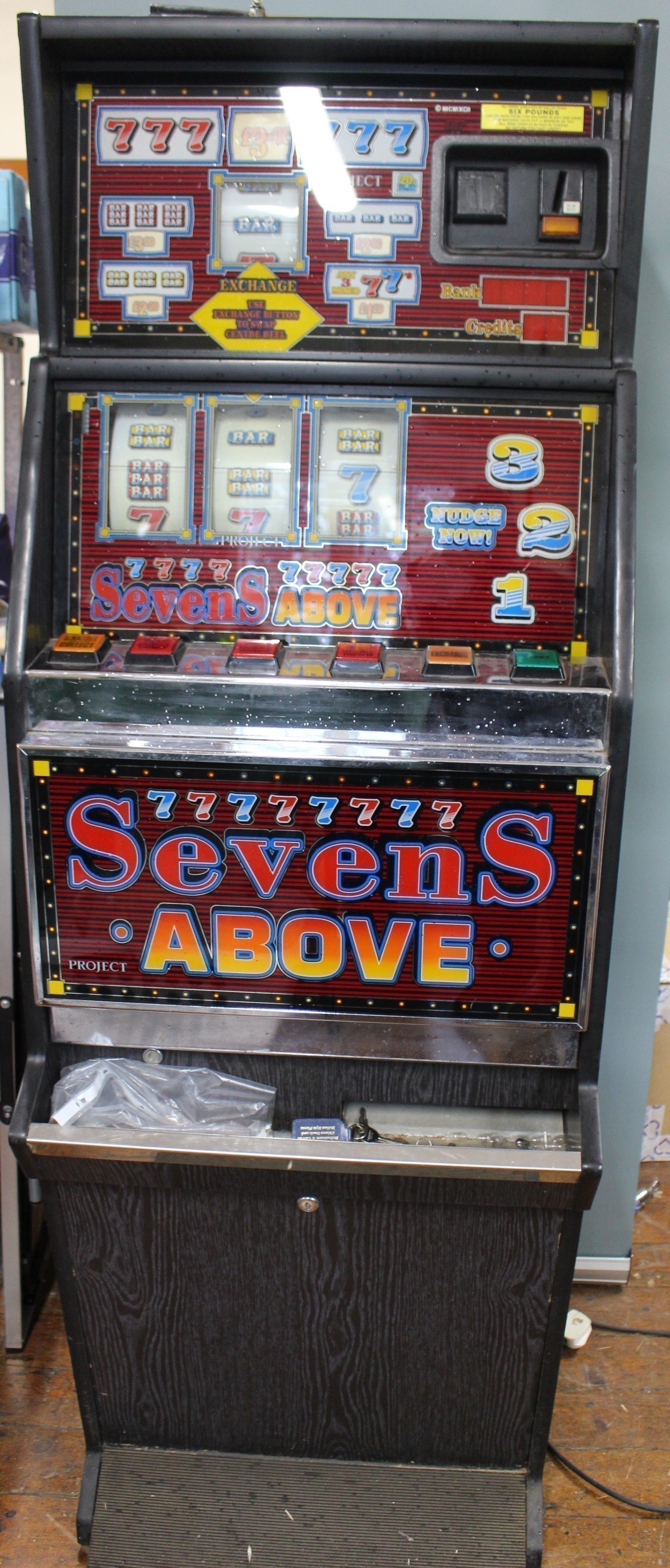 A three wheel "sevens above" 1990's electric fruit machine. Untested ...