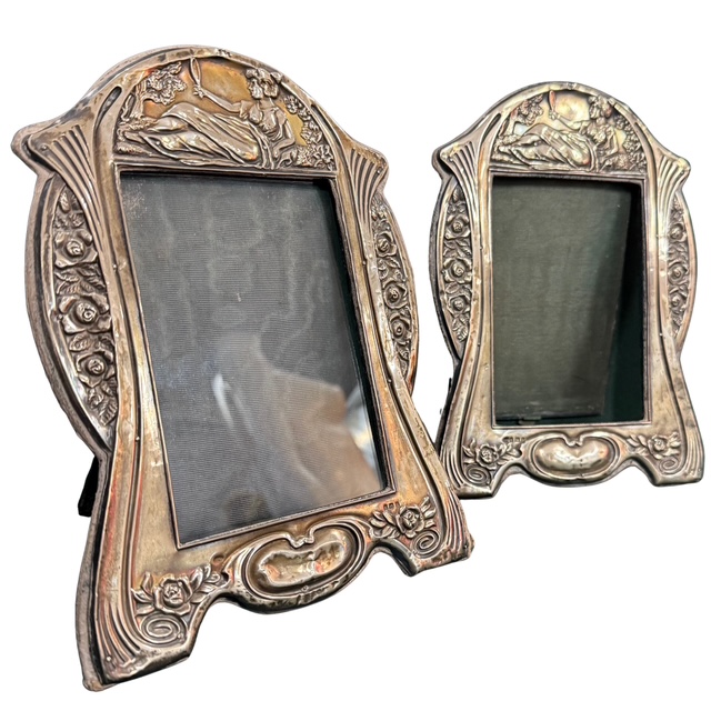 Two Art Nouveau silver easel photo frames depicting a female figure ...