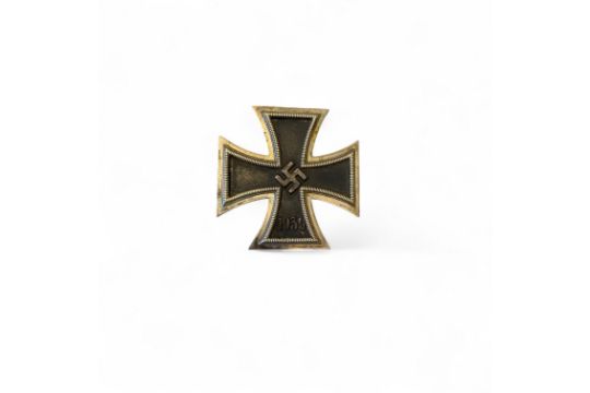 WWII The German Cross in Gold badge and a 1939 Iron Cross badge marked ...