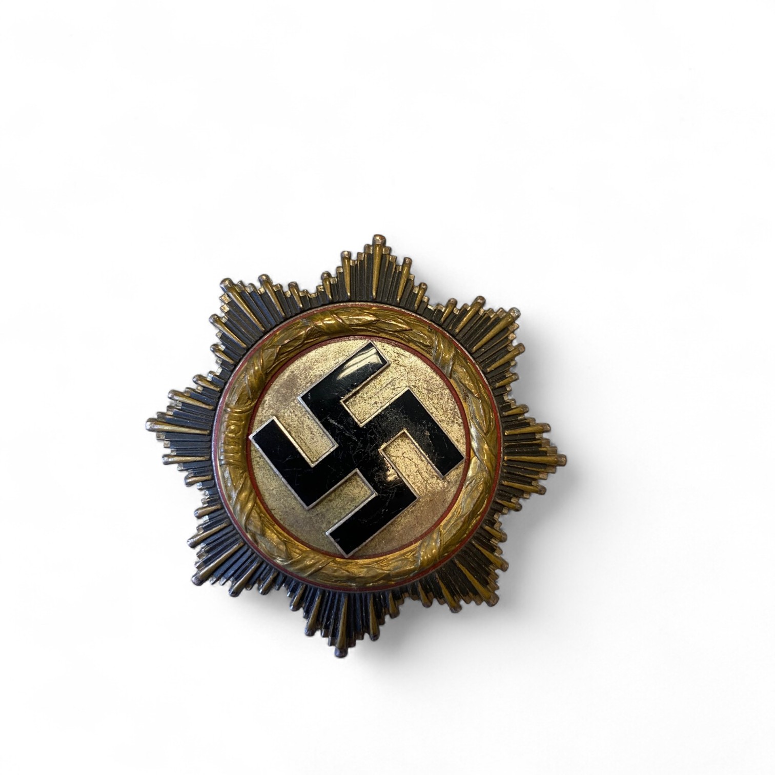 WWII The German Cross in Gold badge and a 1939 Iron Cross badge marked ...