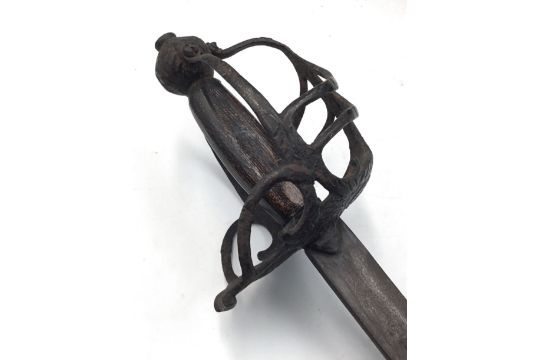 An original English mid 17th century Mortuary Sword. Featuring an iron ...