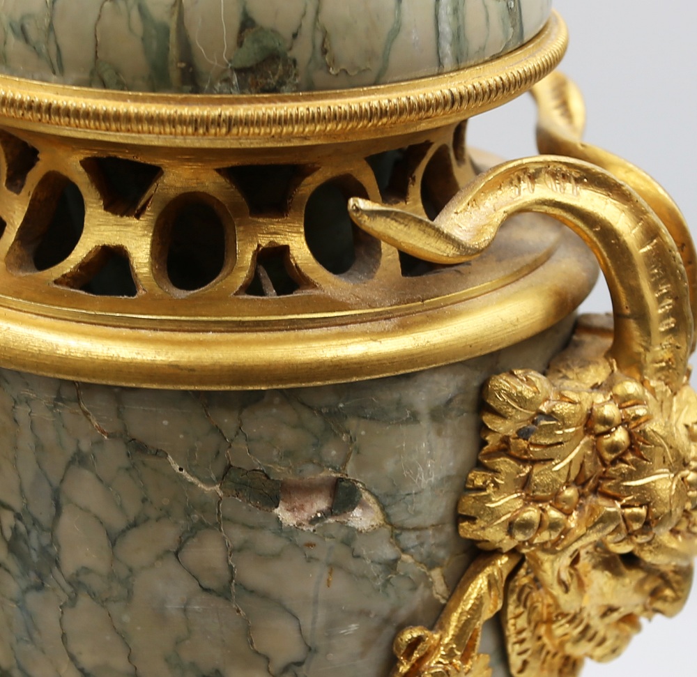 A pair of probably French grey marble and gilt-metal cassolettes, each ...
