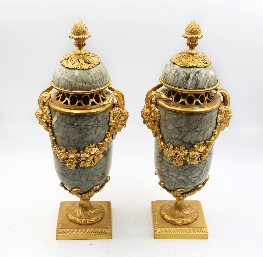 A pair of probably French grey marble and gilt-metal cassolettes, each ...