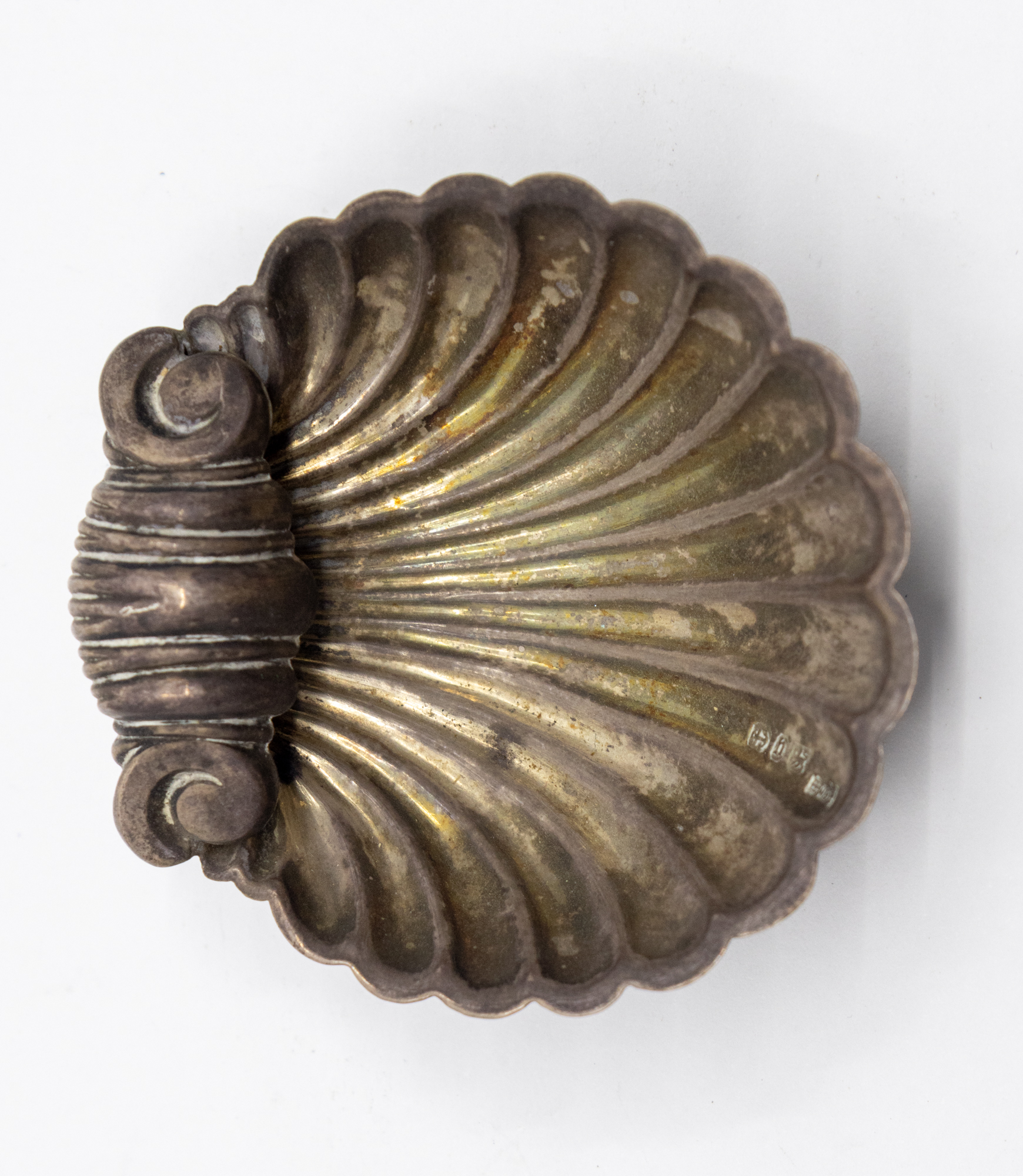 Four late Victorian silver nautilus shell shaped salt cellars, each ...
