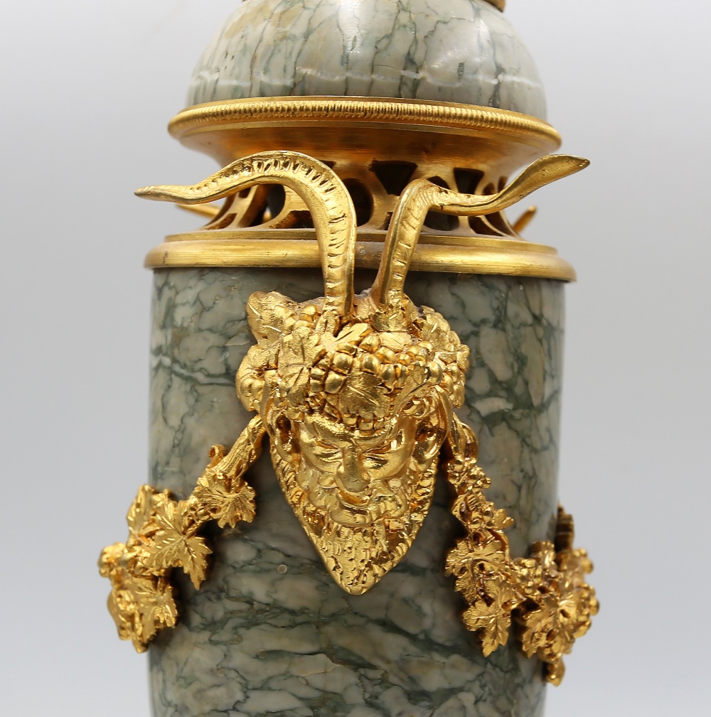 A pair of probably French grey marble and gilt-metal cassolettes, each ...