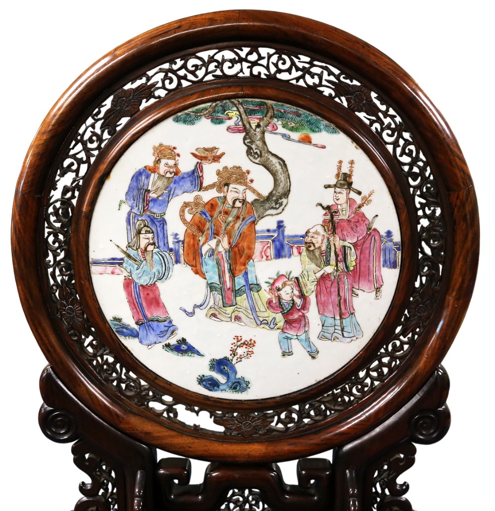 A Chinese porcelain table screen, Qing Dynasty circa 1870, the ...