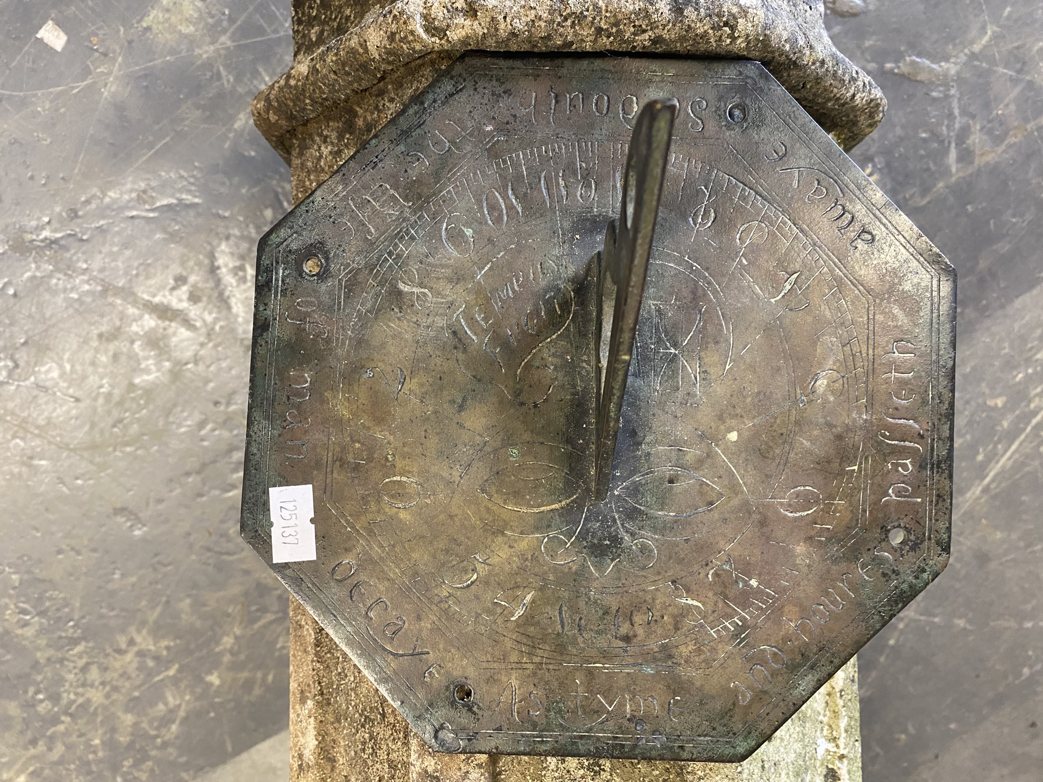 An Early Copper Sundial with stone pillar and plinth