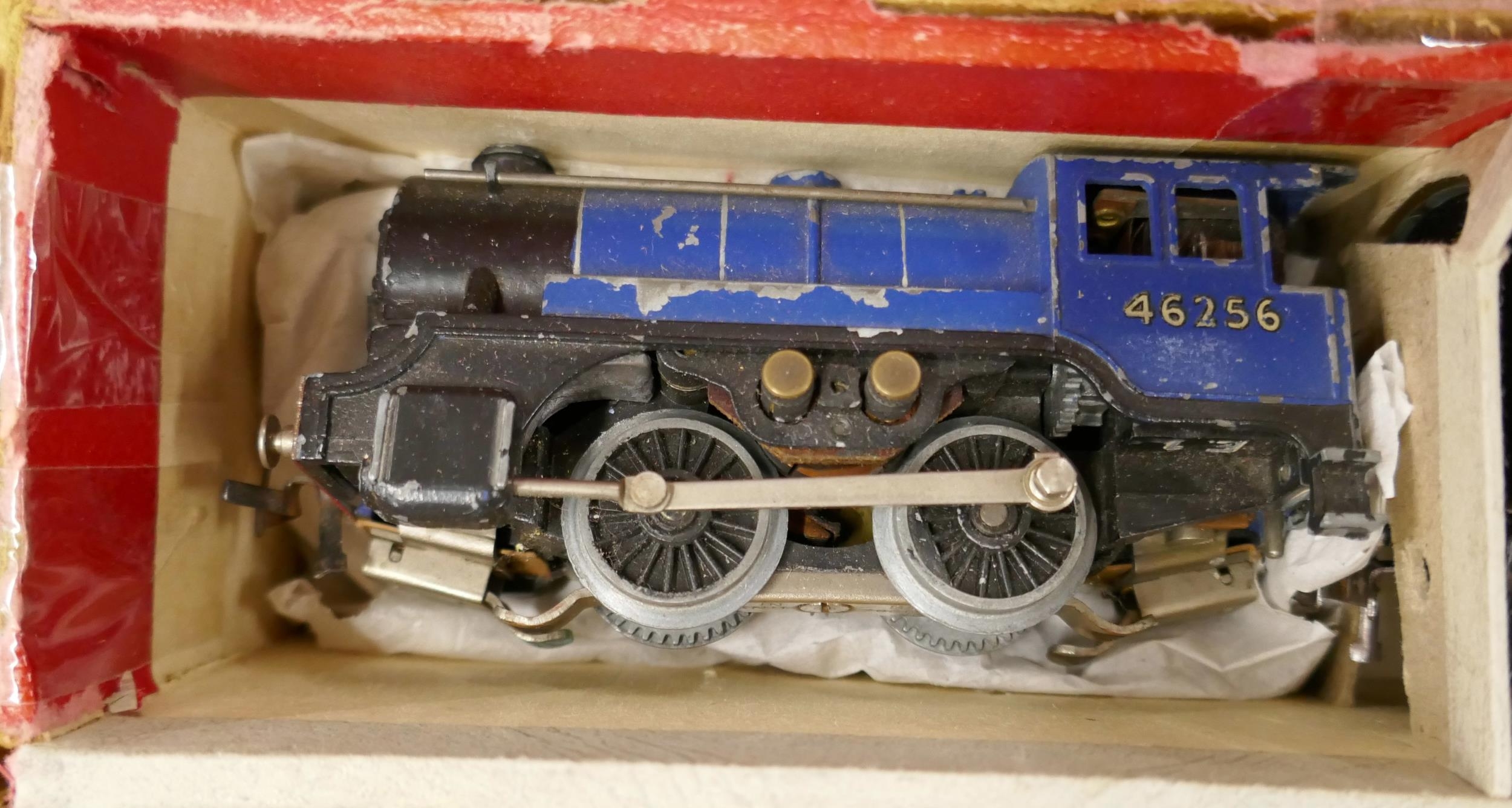 A Trix model train set up with trains, carriages, track, stations and ...