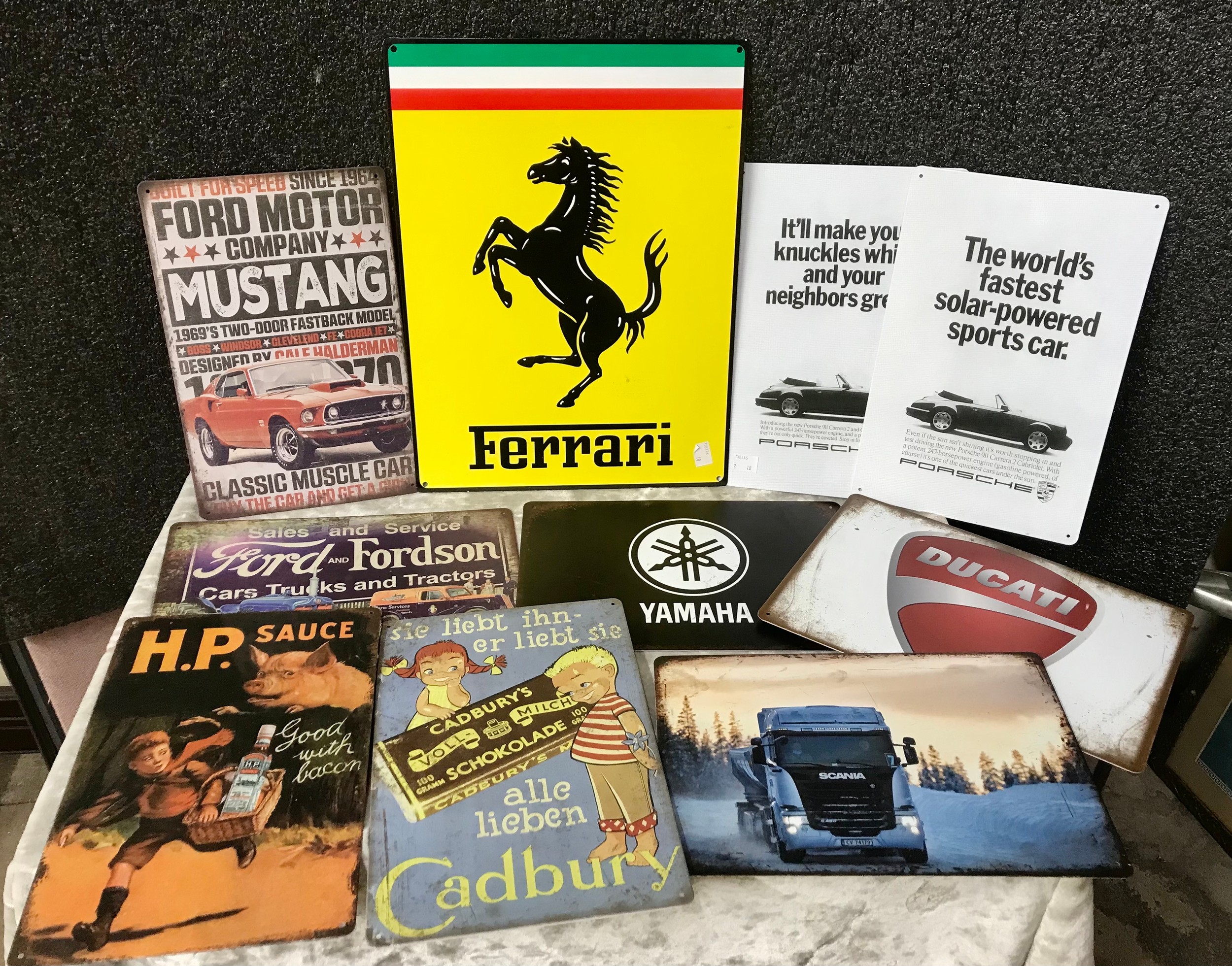Ten motoring related tin advertsing signs