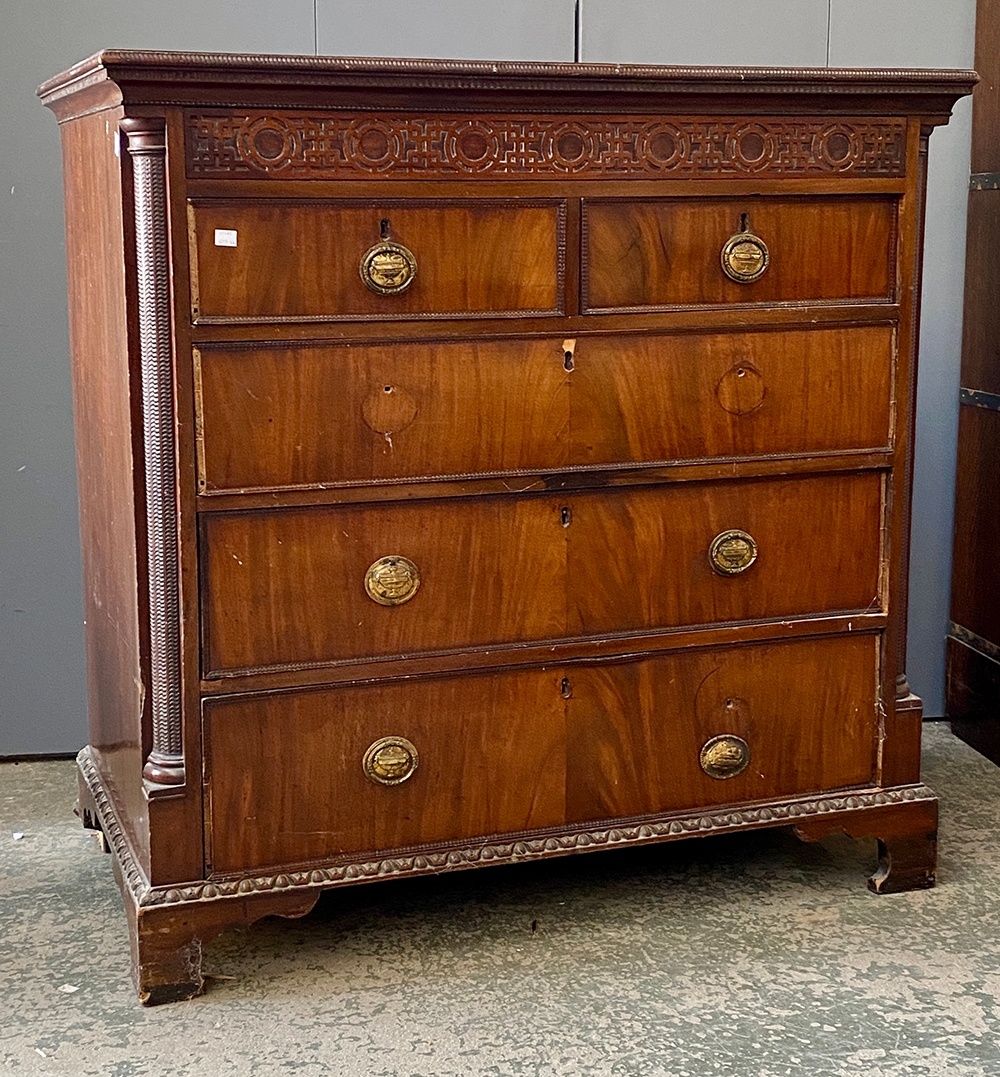 A George III mahogany chest with blind fret carved frieze over two ...