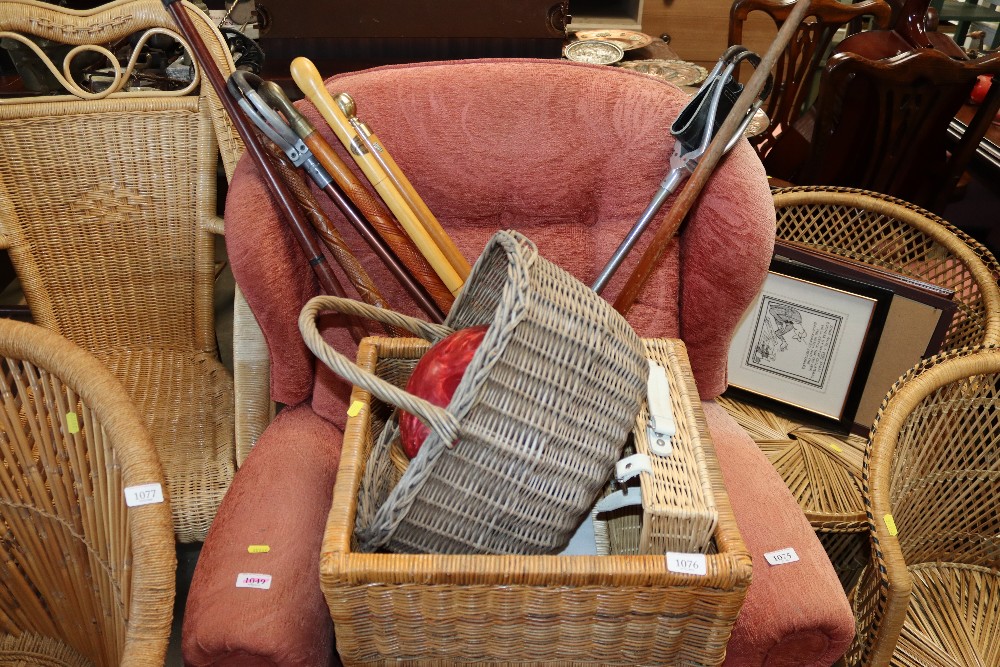 A collection of various wicker ware, walking stick, shooting stick etc
