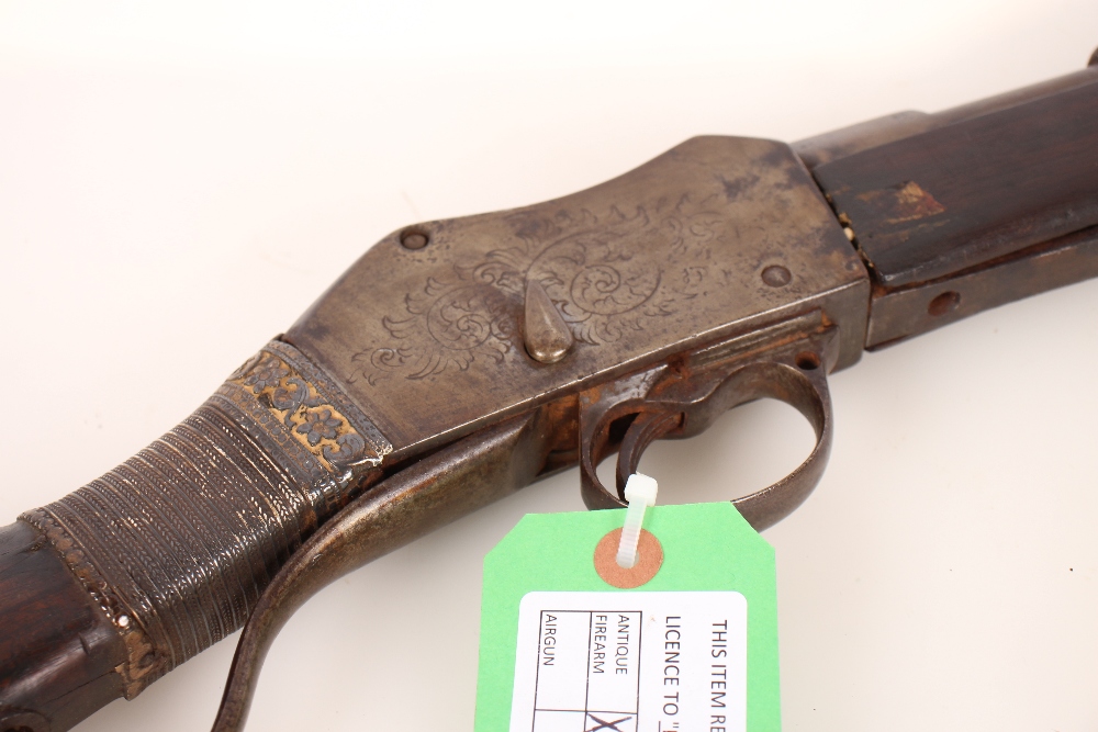 A >577/450 carbine, marked Martini Muscat with ethnic embellishment and AF