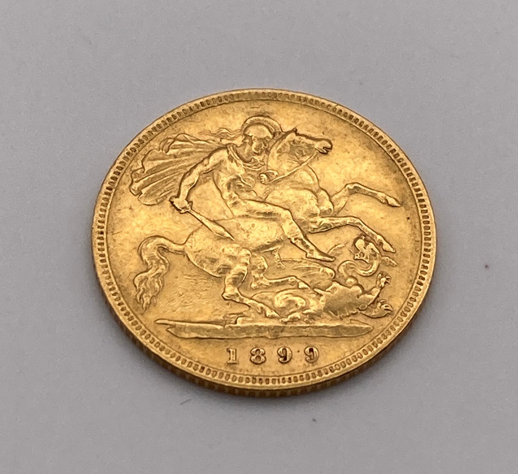 An 1899 Queen Victoria gold half sovereign with Veiled Head and George ...