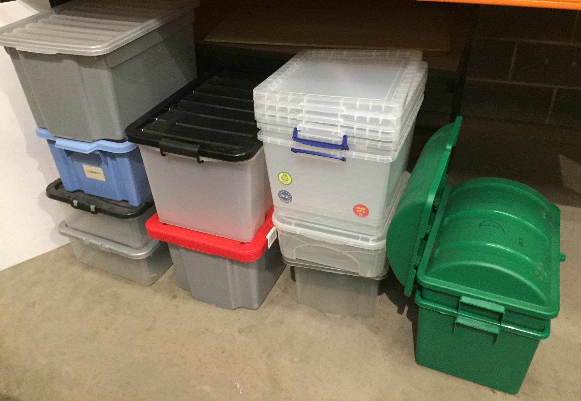 Thirteen assorted plastic lidded storage boxes, including two green ...