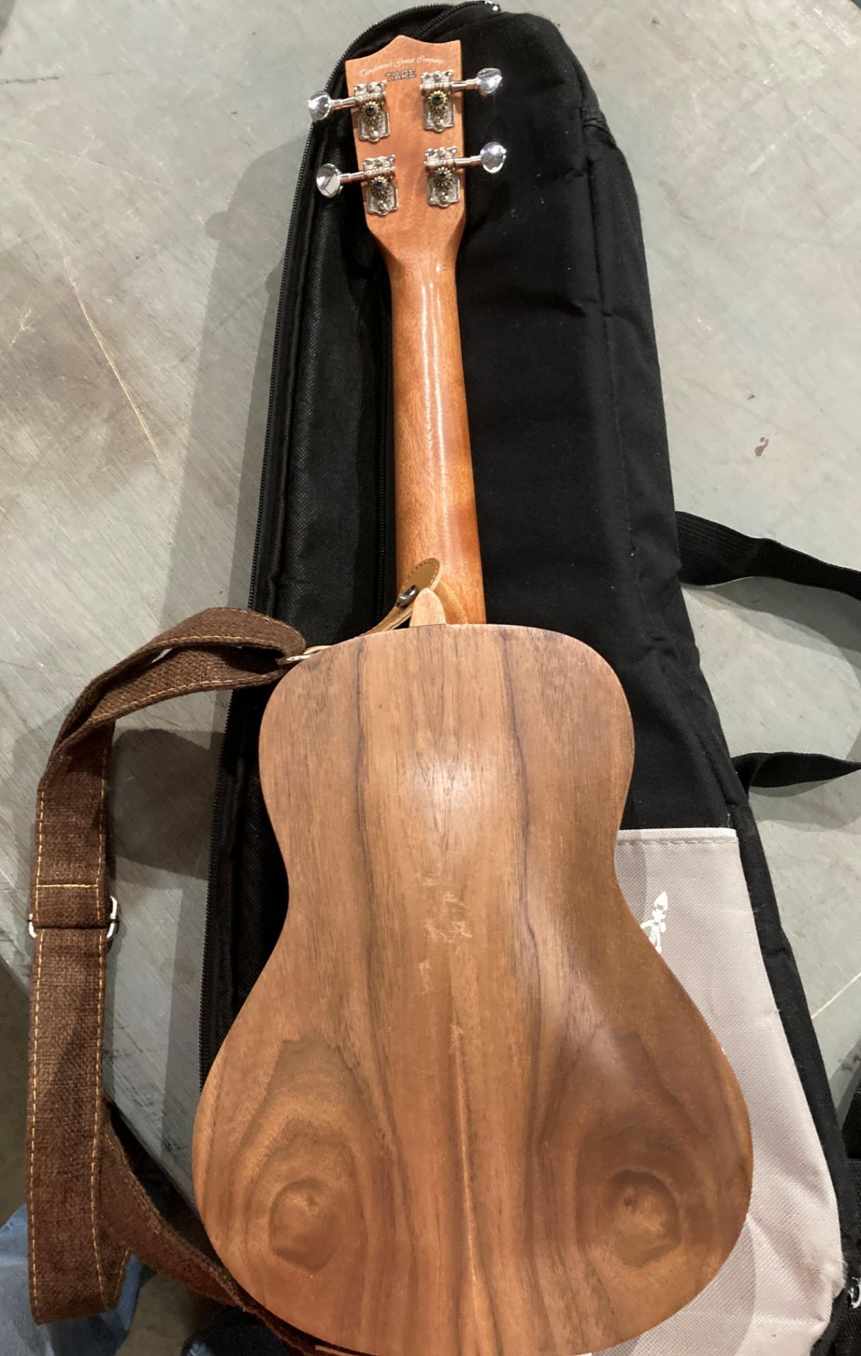 Tanglewood ukulele with Rocket Music soft carry bag and a Nomad music ...